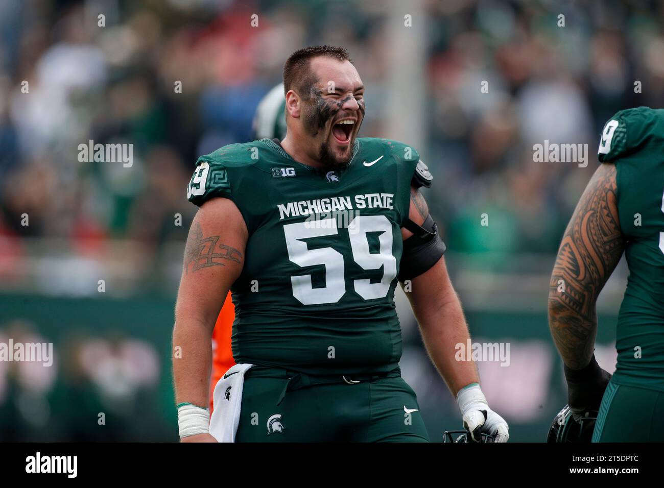 Michigan State center Nick Samac celebrates a touchdown during an NCAA ...
