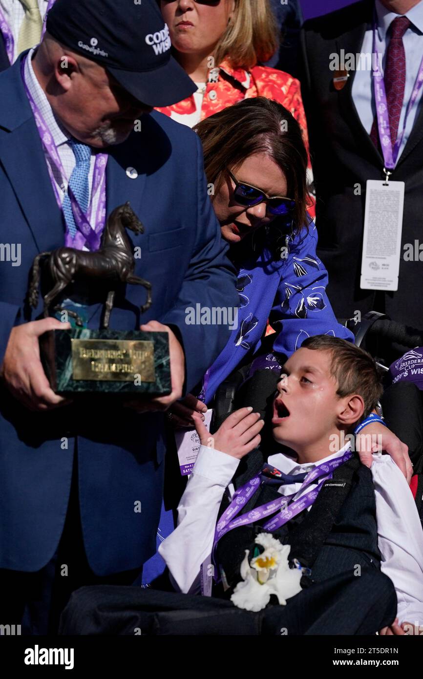 Cody Dorman, right, sits alongside his father Kelly Dorman, left, and ...