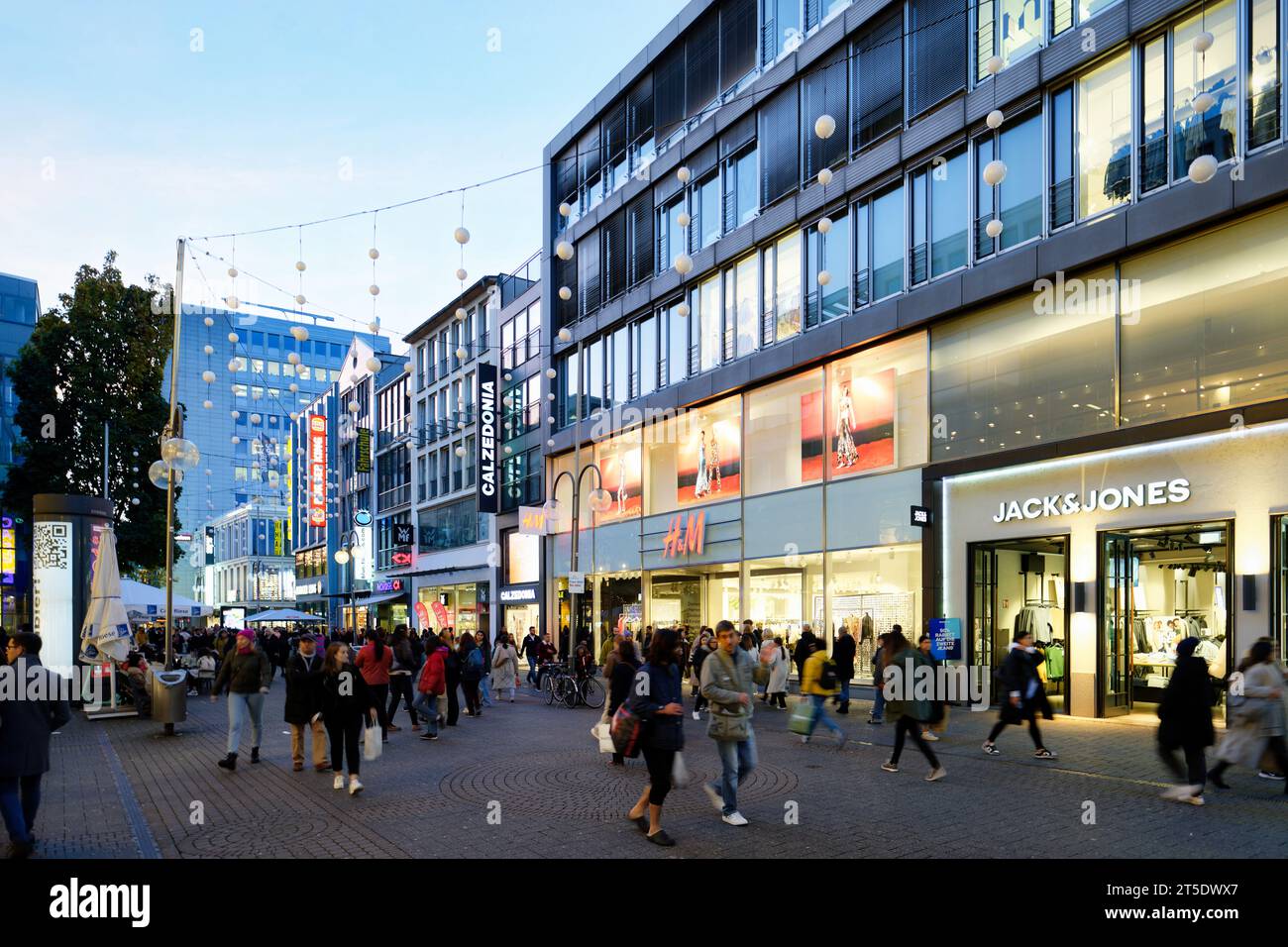 Cologne, Germany November 03 2023: Illuminated stores at dusk on the ...