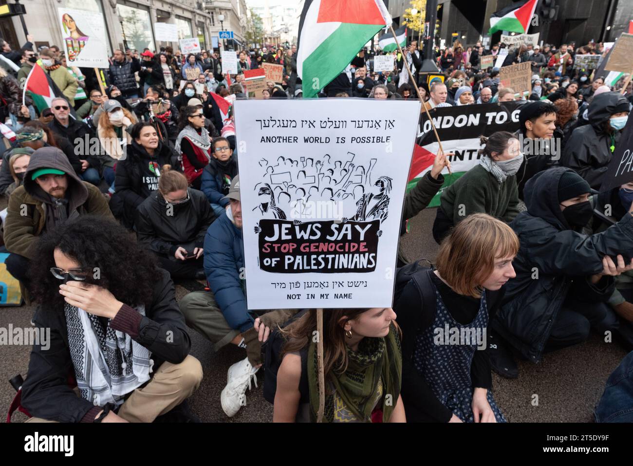 London, UK. 4 November, 2023. Activists stage a sit-down protest in ...