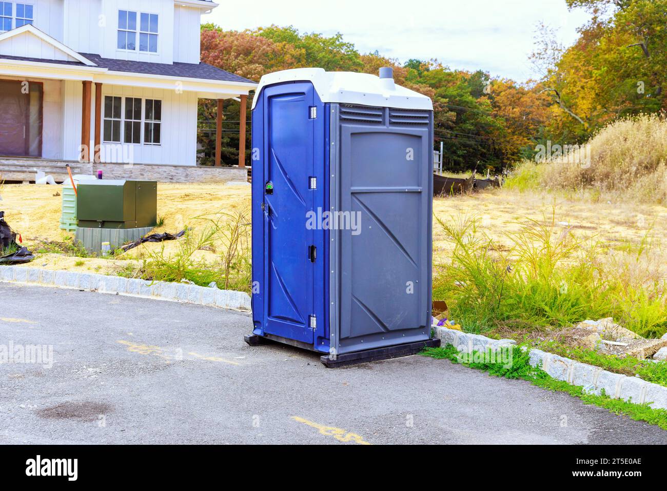 Portable temporary toilet is located on construction site during build ...