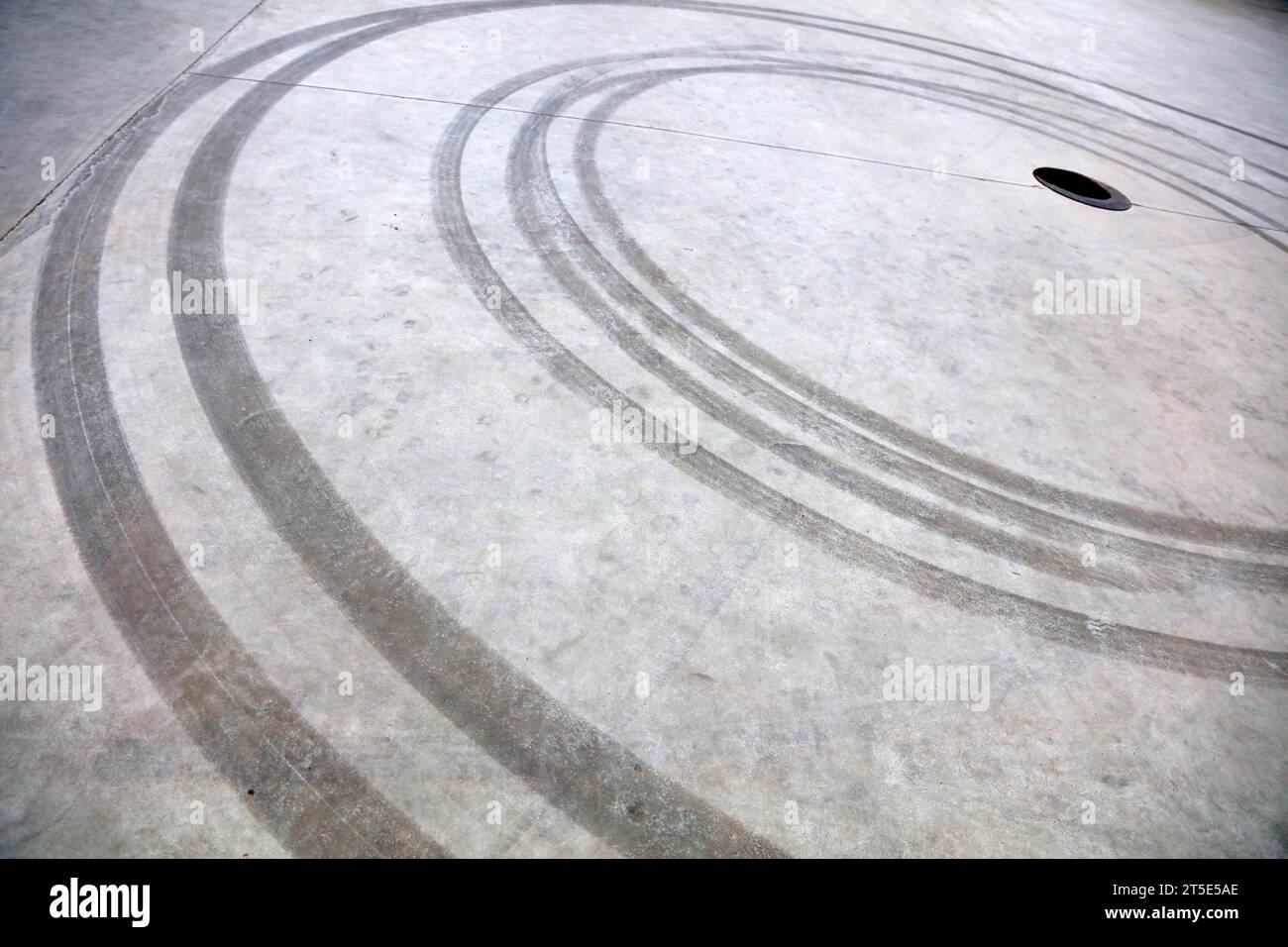 wheel track is on the cement ground Stock Photo - Alamy