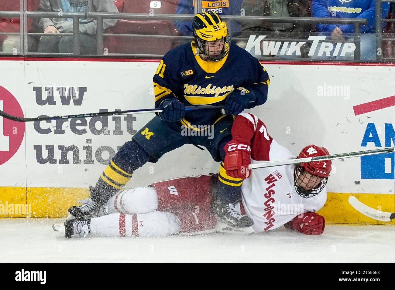 Michigan's Frank Nazar (91) and Wisconsin's Daniel Laatsch (2) battle ...