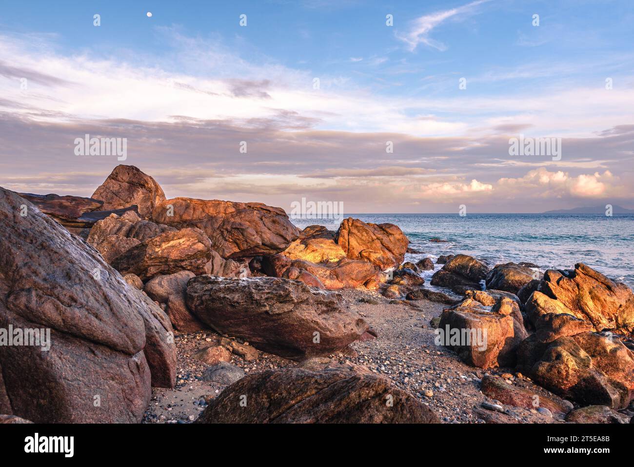 Scenic rock formation during sunrise at the beach of Mindoro ...