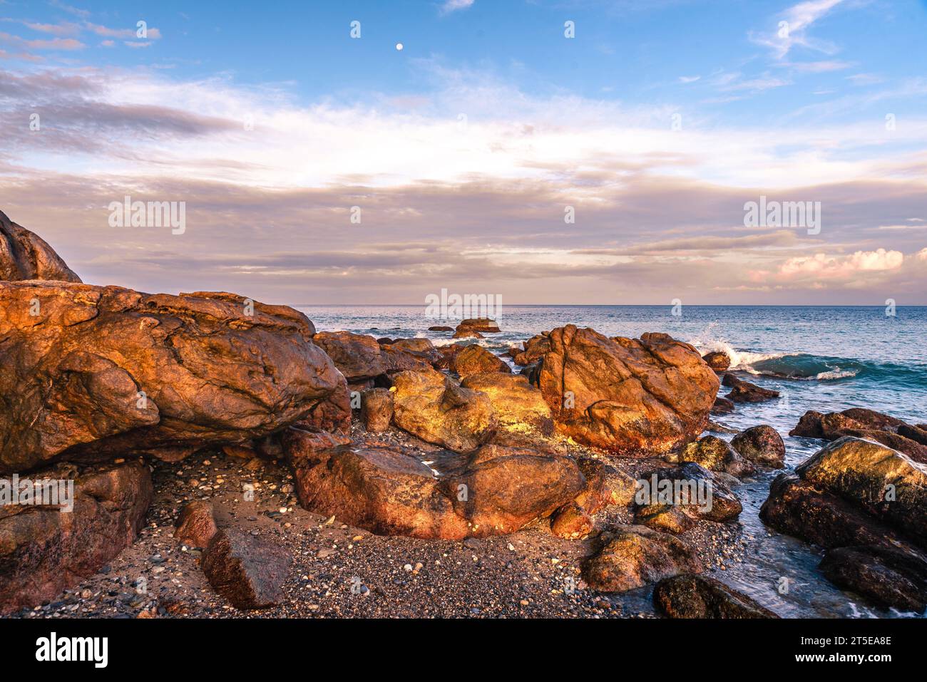 Scenic rock formation during sunrise at the beach of Mindoro ...