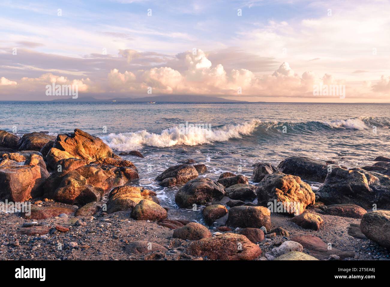 Scenic rock formation during sunrise at the beach of Mindoro ...