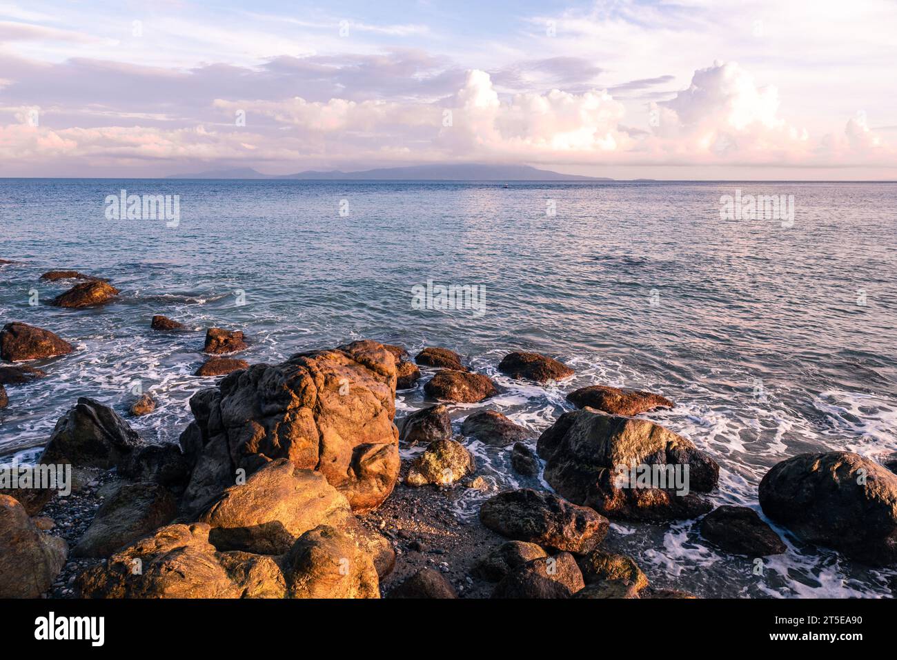Scenic rock formation during sunrise at the beach of Mindoro ...