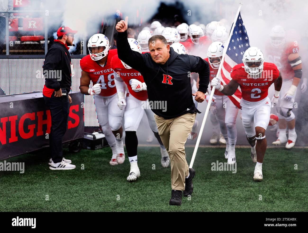 Rutgers head coach Greg Schiano enters the stadium for a NCAA college ...
