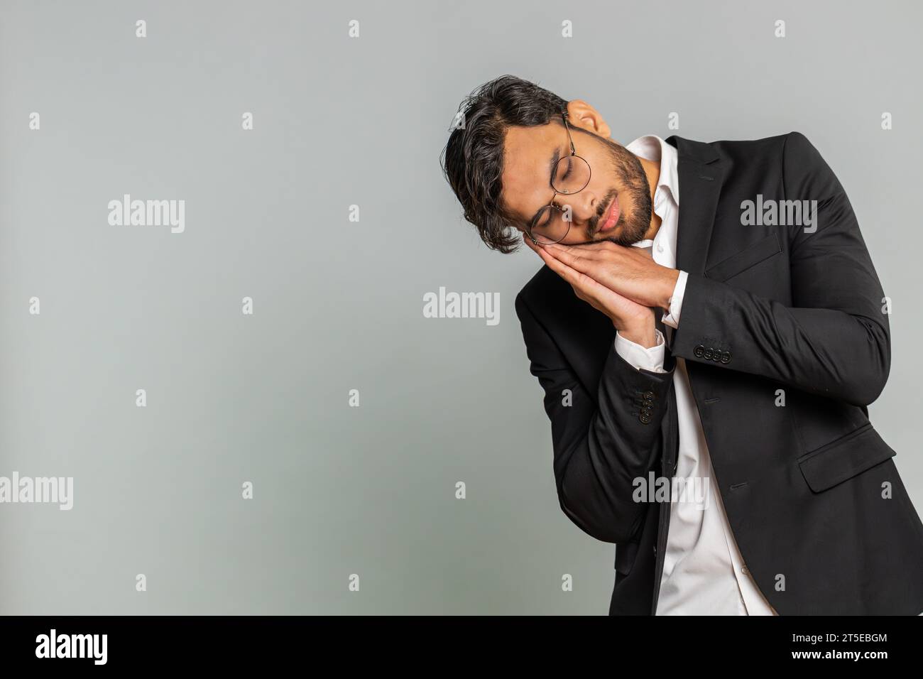 Tired exhausted Indian businessman yawning, sleepy inattentive feeling ...