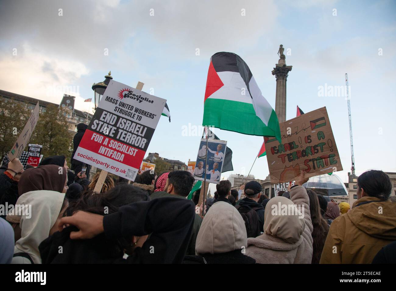London, UK. 4th Nov, 2023. Protesters are holding up signs in Trafalgar ...