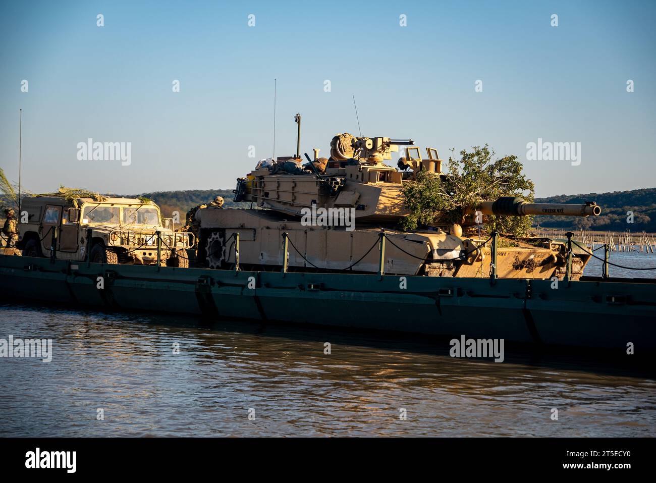 An M1 Abrams Main Battle Tank and a High Mobility Multipurpose Wheeled ...