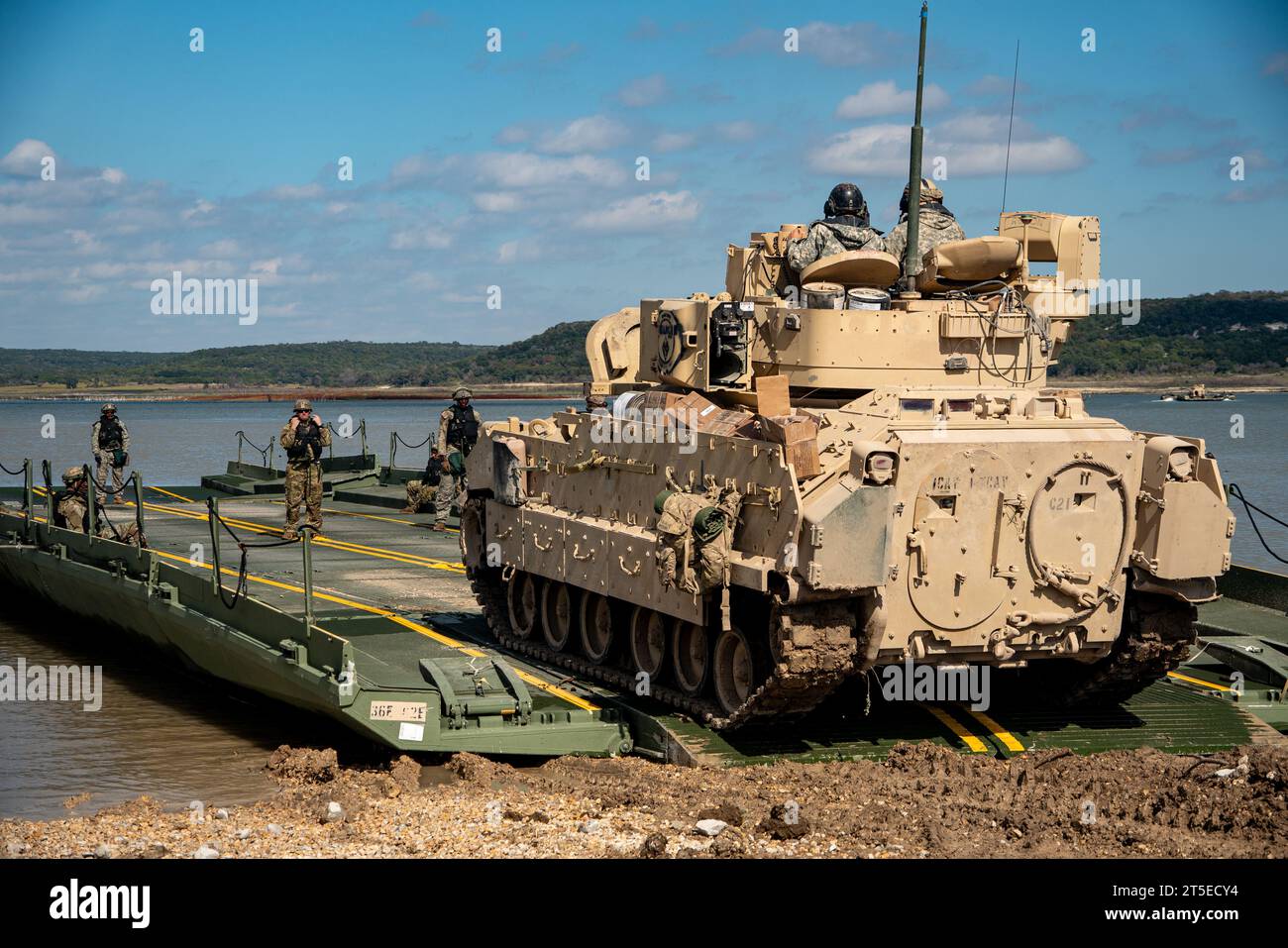 A Bradley Fighting Vehicle drives onto an Improved Ribbon Bay Bridge in ...