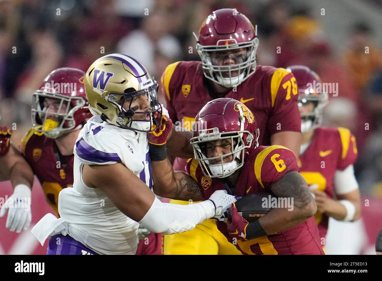 Southern California running back Austin Jones (6), right, stiff-arms ...
