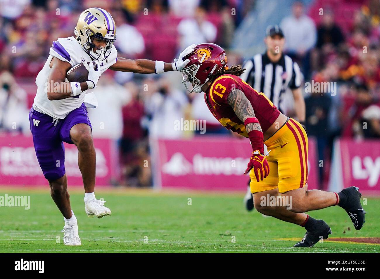 Washington wide receiver Rome Odunze, left, stiff-arms Southern ...