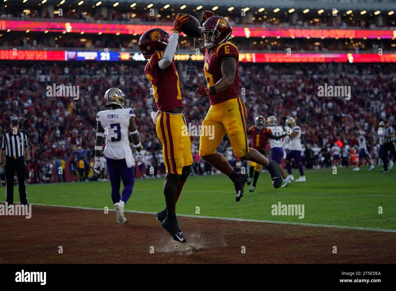 Southern California wide receiver Tahj Washington, left celebrates his ...