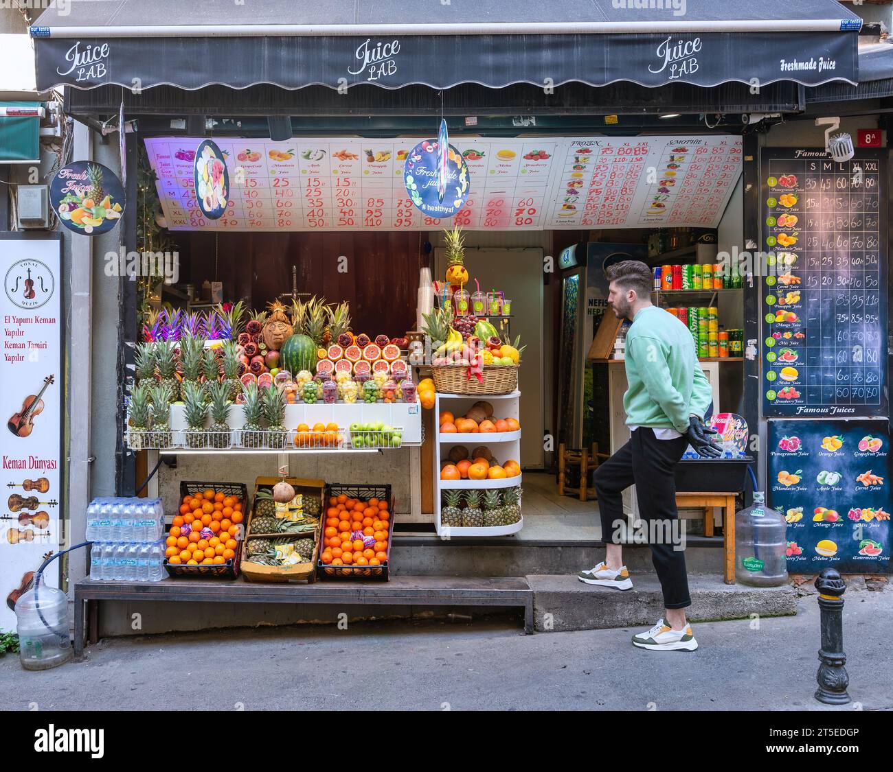 Istanbul, Turkey - May 13, 2023: Bustling fruit stand and juice bar ...