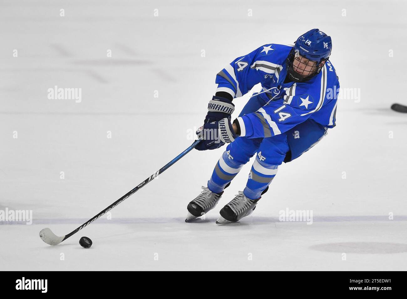 Air Force left wing Jacob Marti (14) skates with the puck during the ...