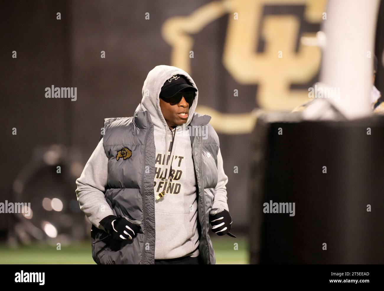 Colorado coach Deion Sanders walks the perimeter of the field as ...