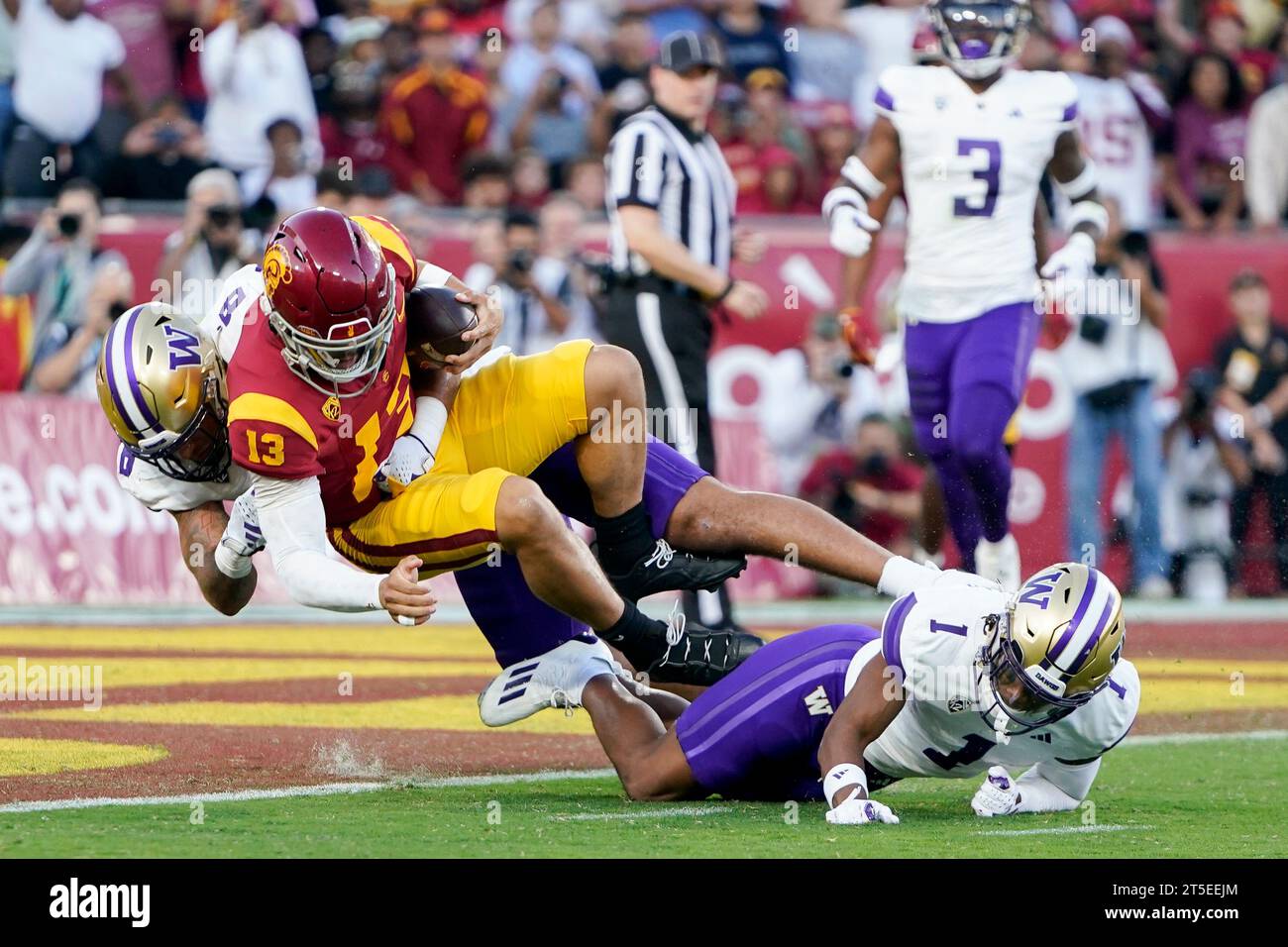 Southern California quarterback Caleb Williams, center, falls into the ...