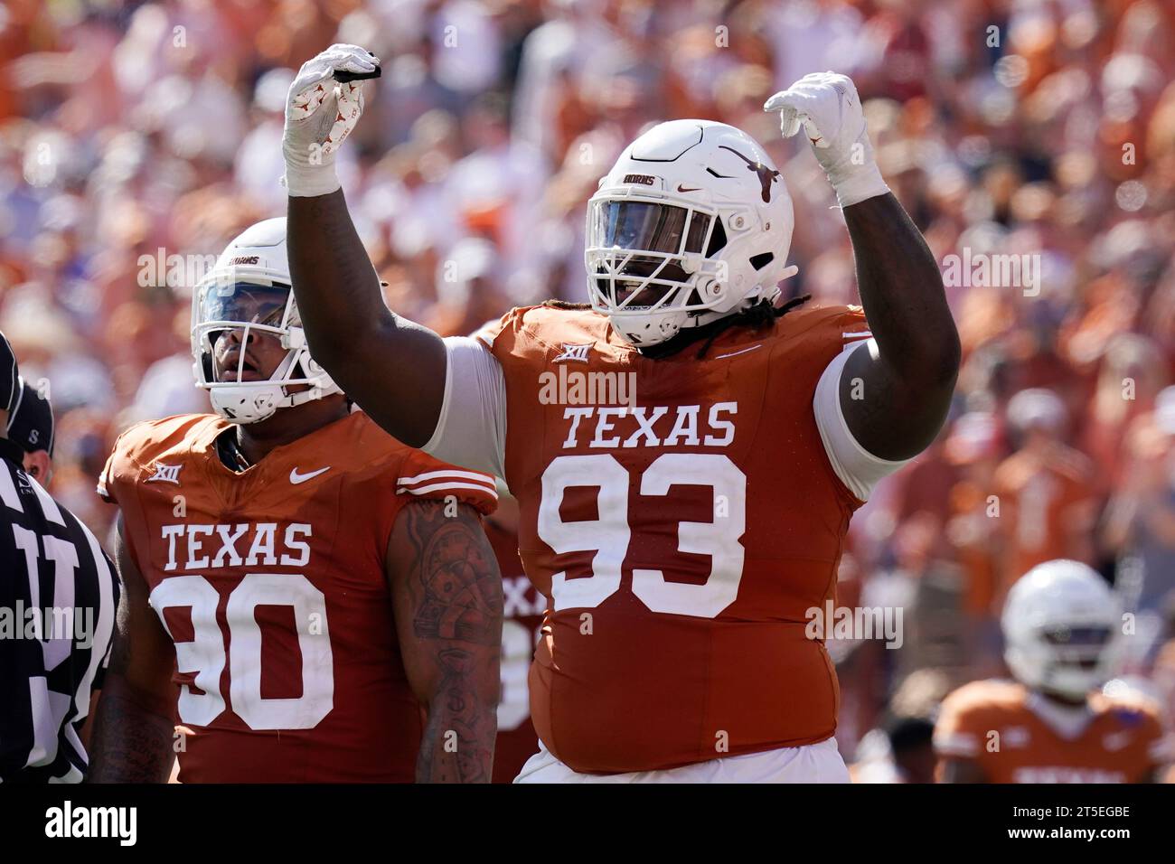 Texas defensive lineman Sydir Mitchell (99) and Texas defensive lineman ...