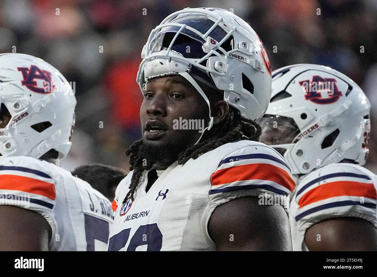 Auburn defensive lineman Marcus Harris stands in the huddle during a ...