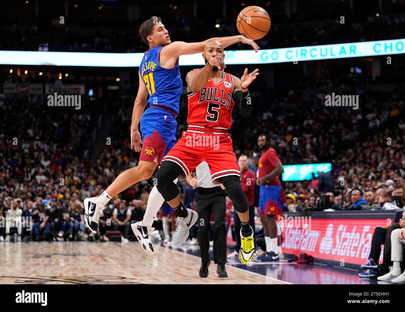 Chicago Bulls guard Jevon Carter (5) passes under pressure from Denver ...