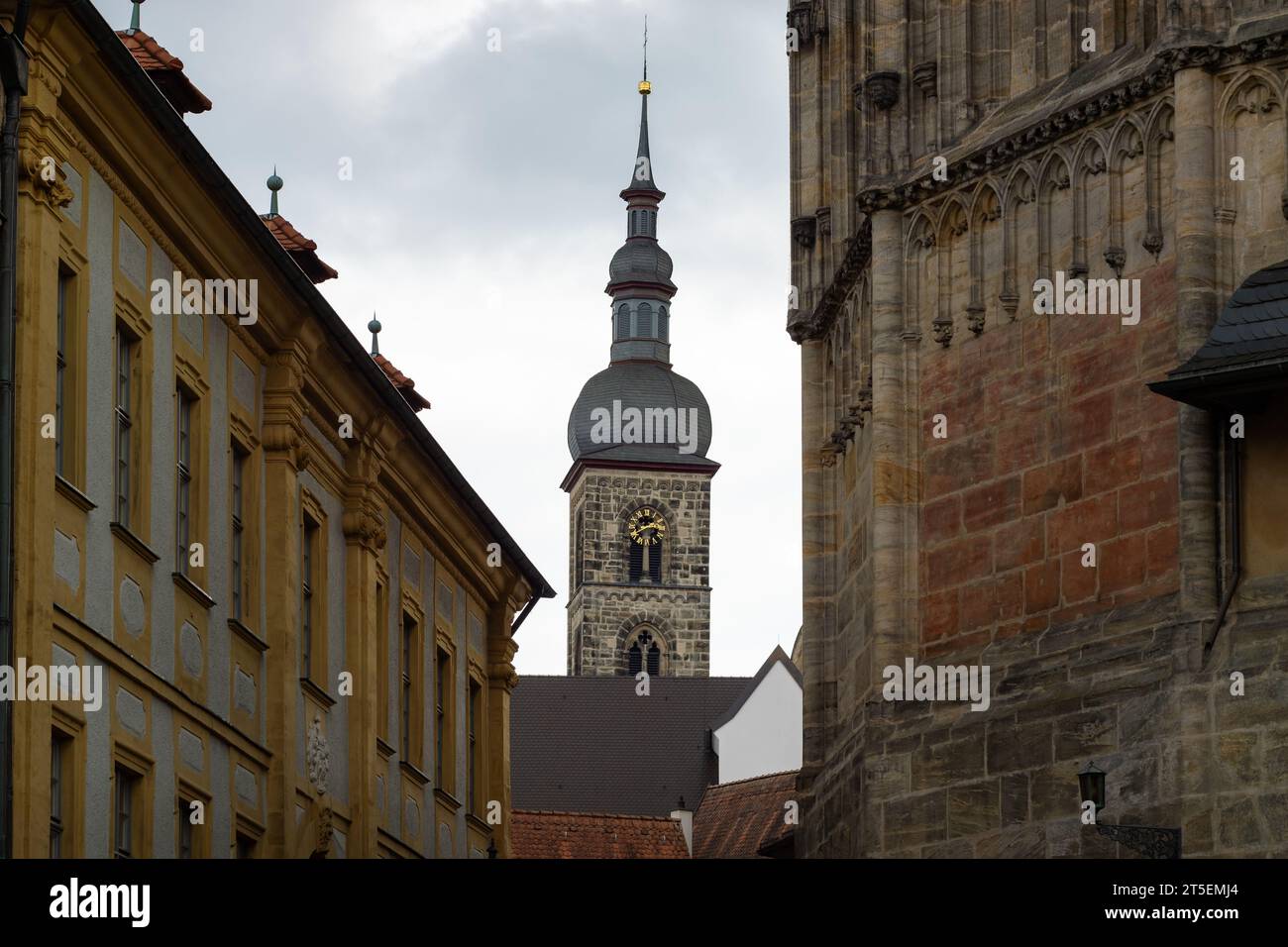 St. Stephan's Church tower above old town buildings. Famous landmark in ...