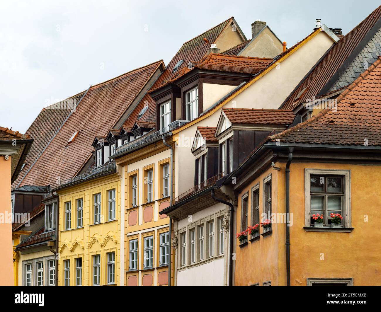 Building facades in an old town. Small houses with exteriors in ...