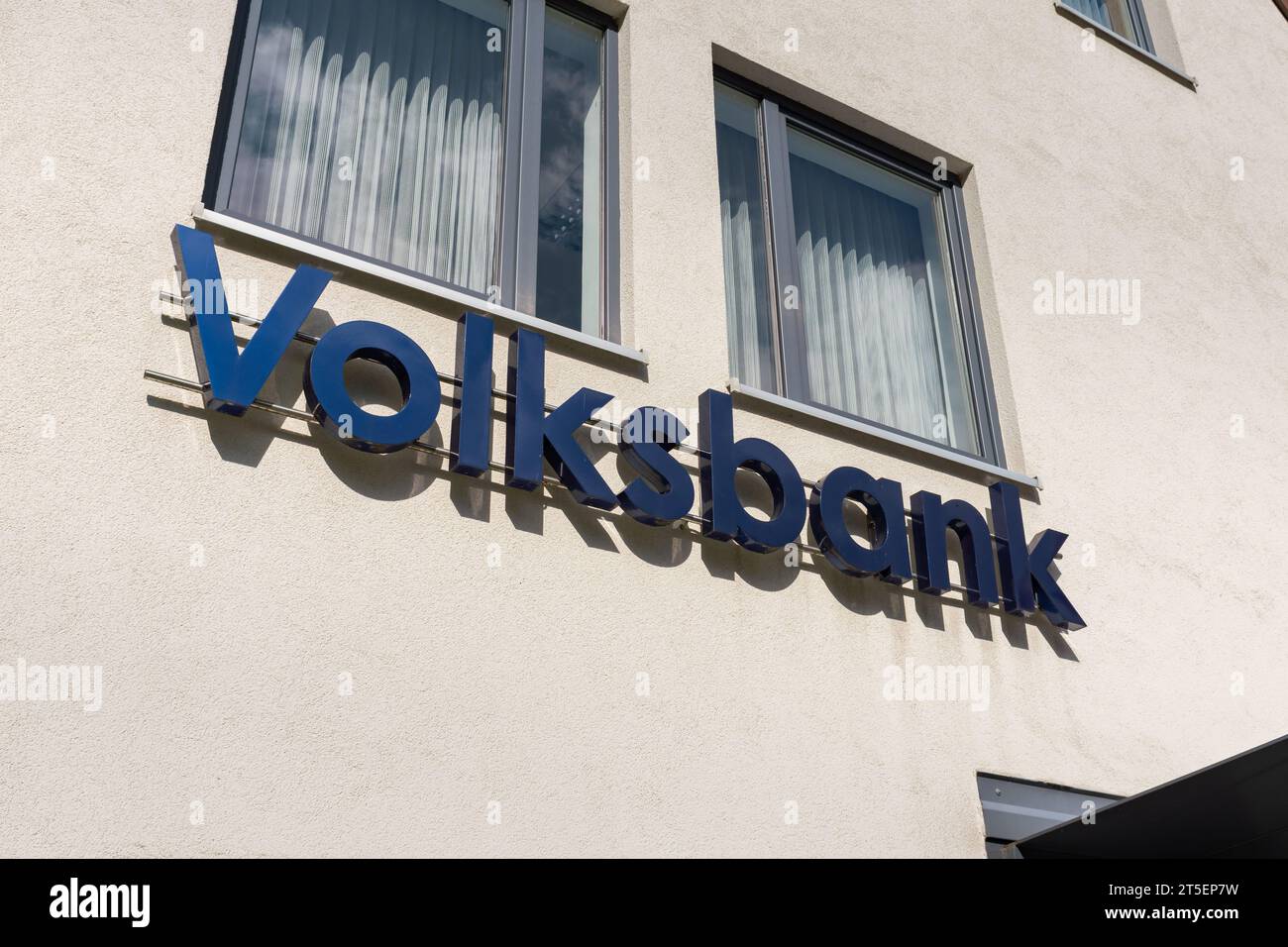 Volksbank logo sign of the bank on the building facade. Logotype in big ...