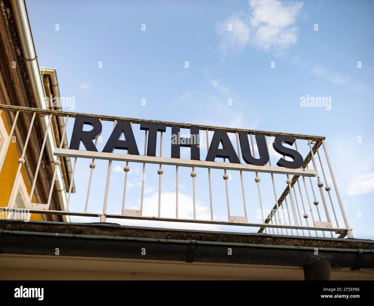 Rathaus (town hall) lettering in the railing of a building. German ...