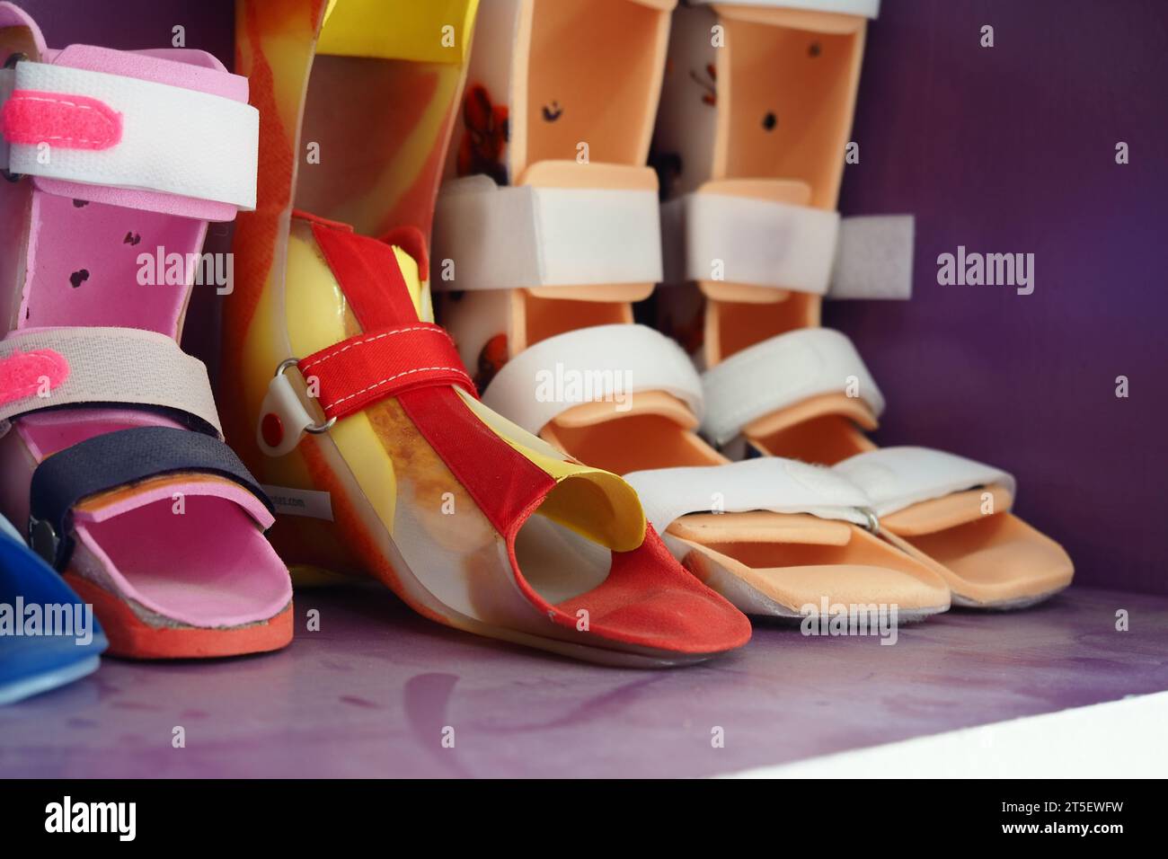 Child cerebral palsy legs orthosis shoes displaying Stock Photo - Alamy