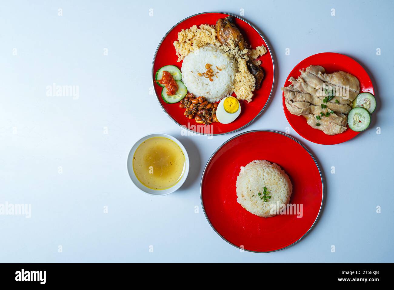Nasi Lemak and Nasi Hainan on isolated white background. A set of ...