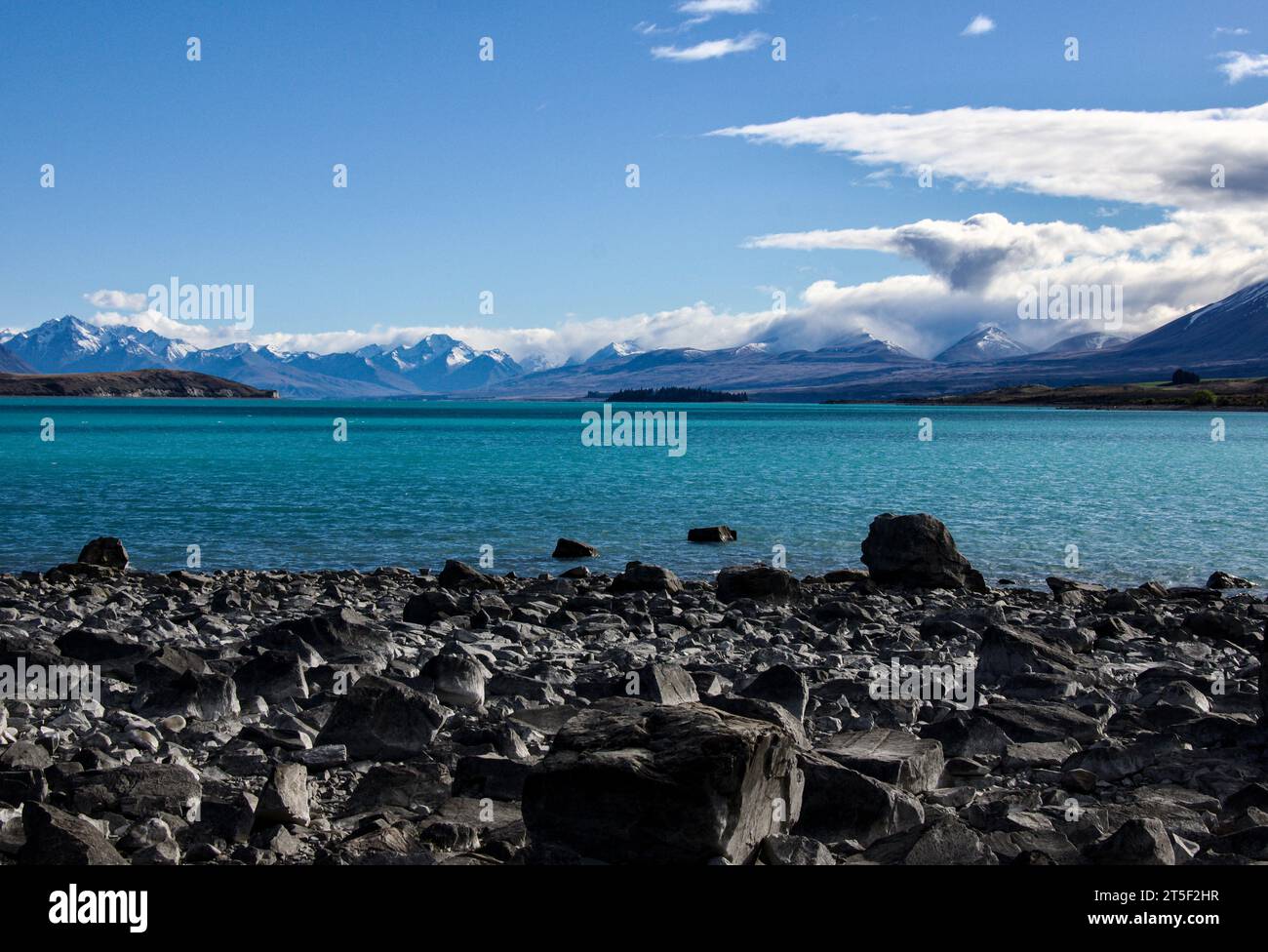 View of Lake Tekapo and the surrounding snow capped mountains. at the ...