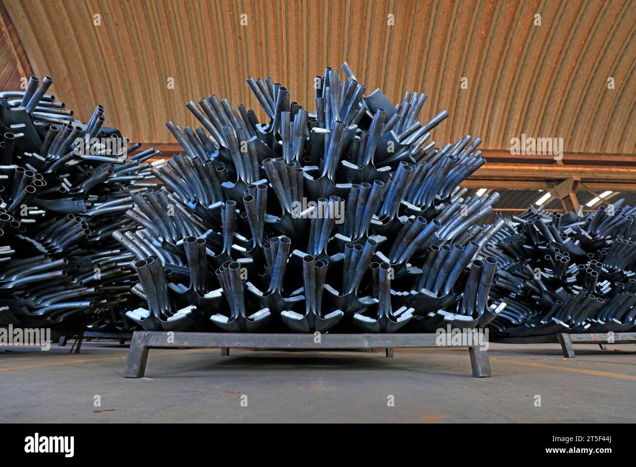 Piles of steel spades Stock Photo - Alamy