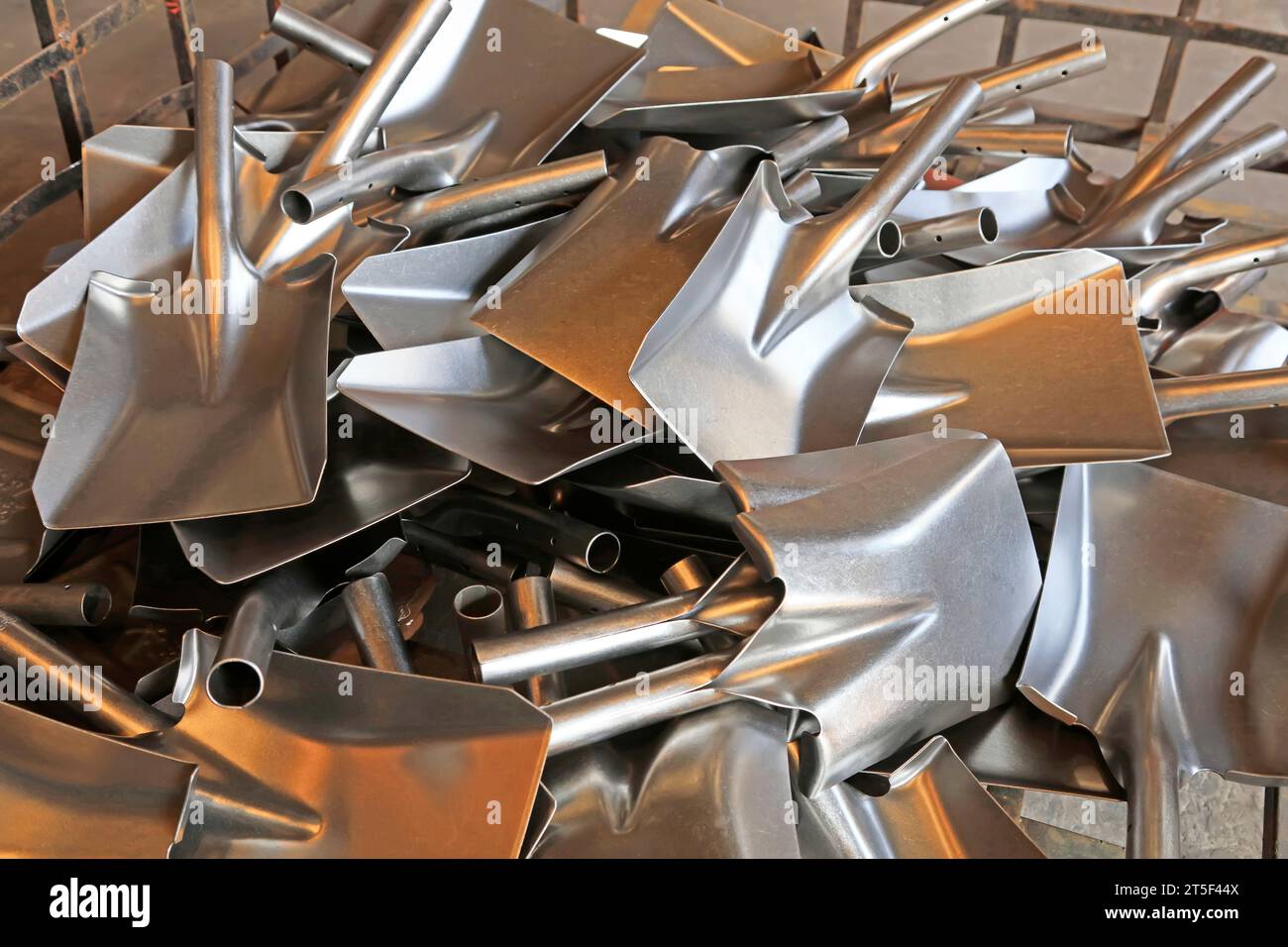 Piles of steel spades Stock Photo - Alamy