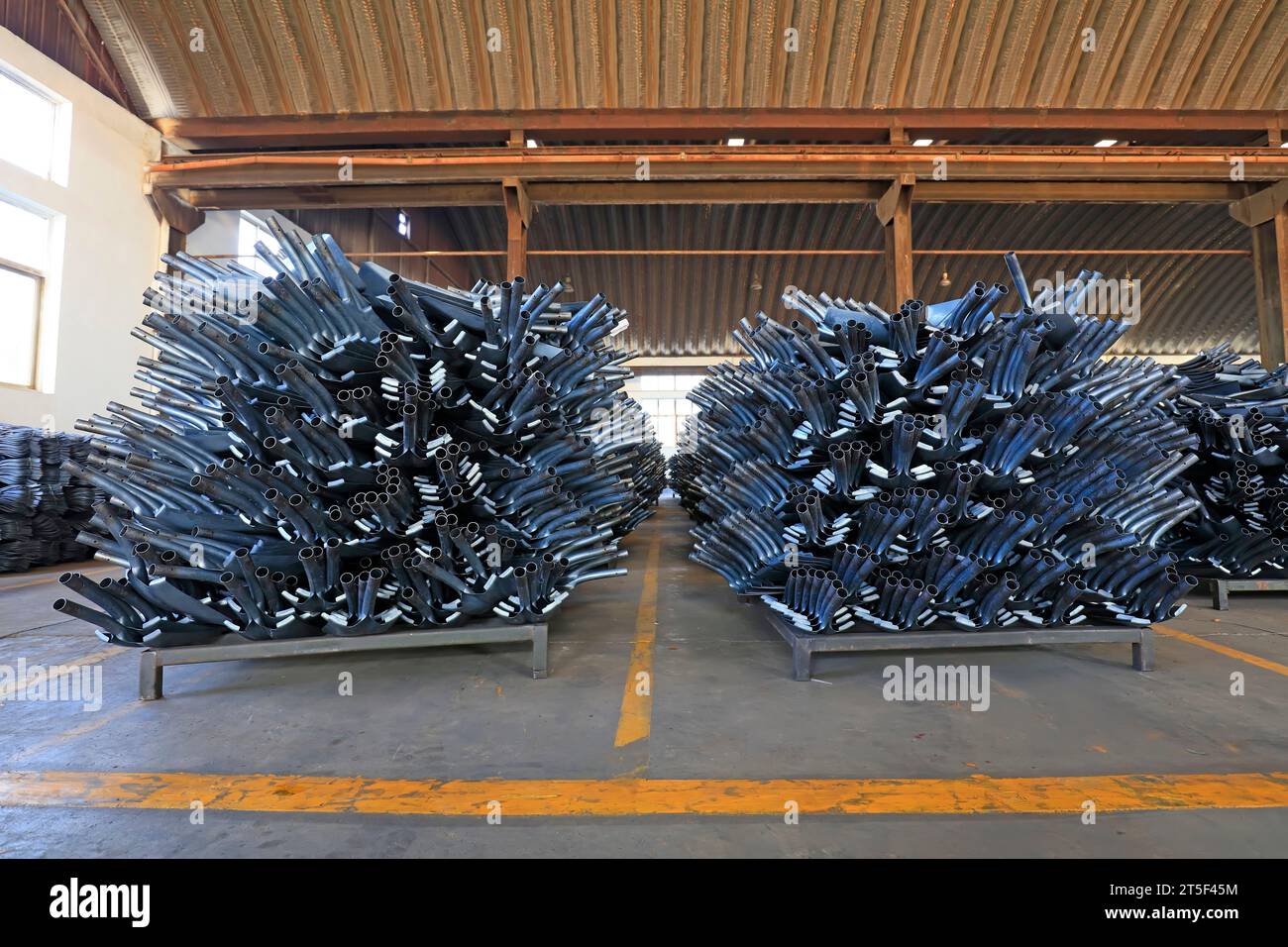 Piles of steel spades Stock Photo - Alamy