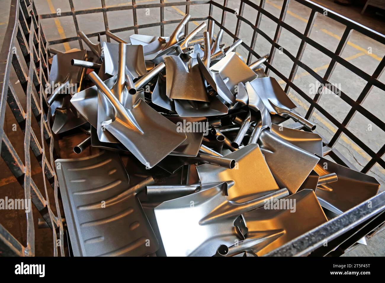 Piles of steel spades Stock Photo - Alamy