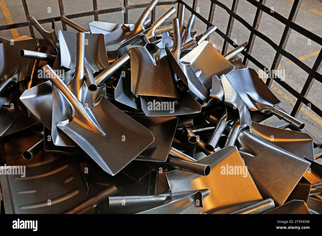 Piles of steel spades Stock Photo - Alamy