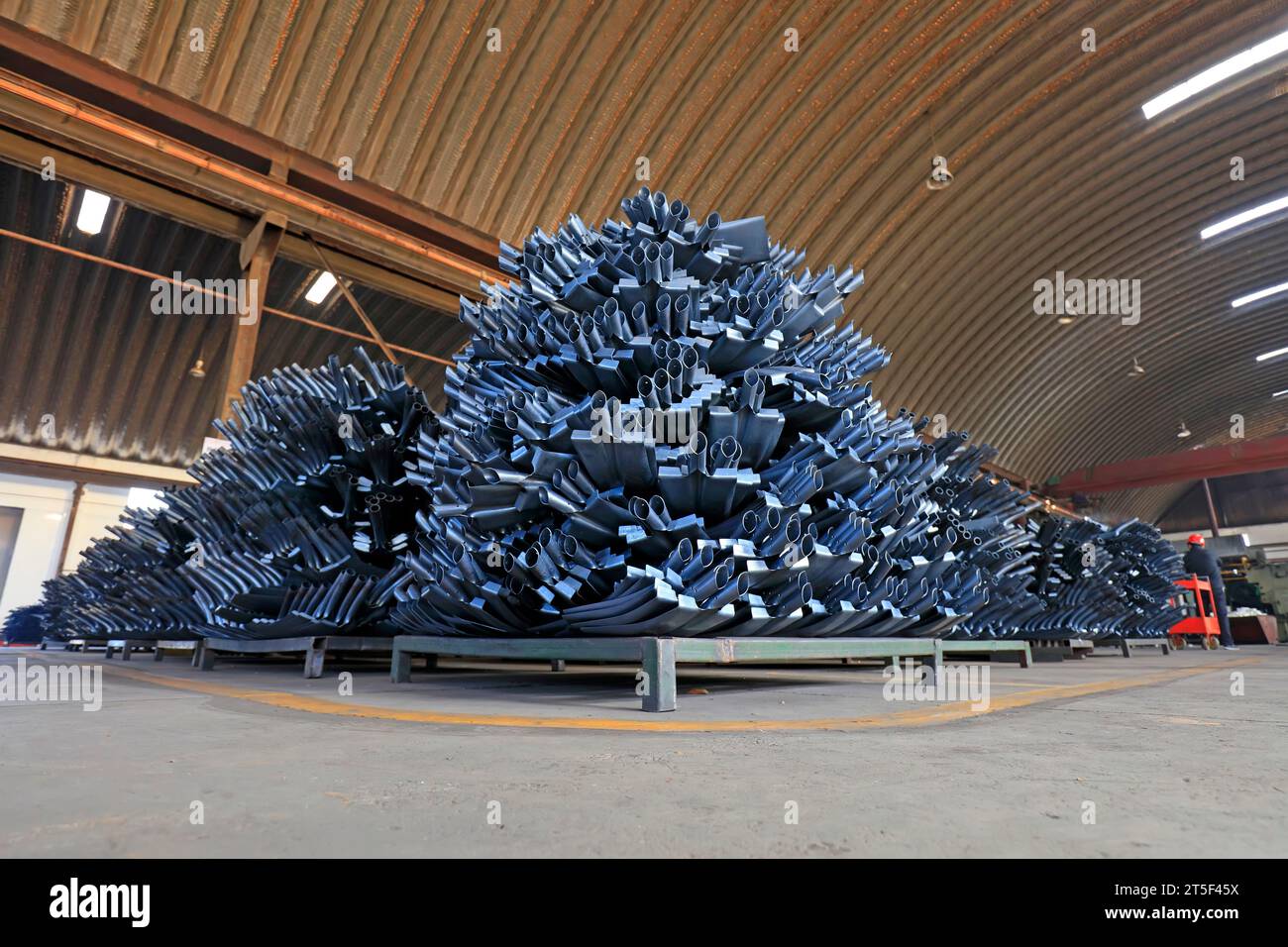 Piles of steel spades Stock Photo - Alamy