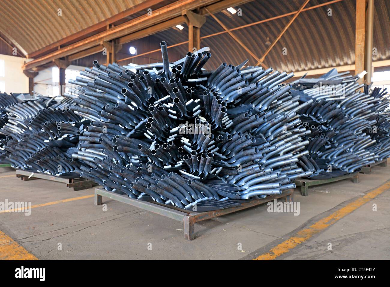 Piles of steel spades Stock Photo - Alamy