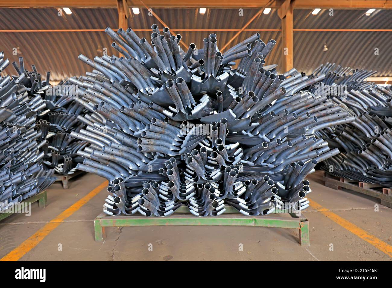 Piles of steel spades Stock Photo - Alamy