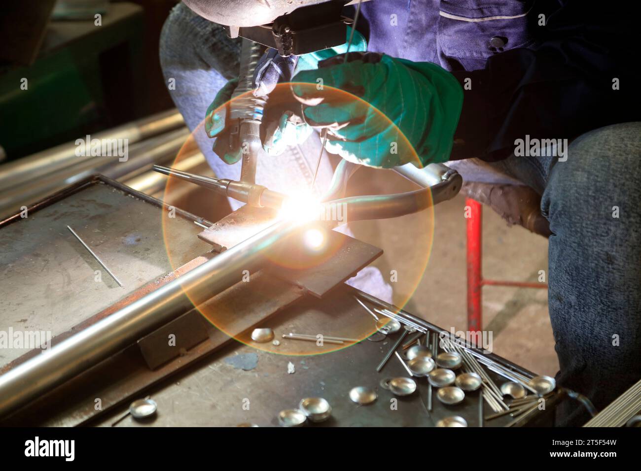 Welding of steel spade handle Stock Photo - Alamy