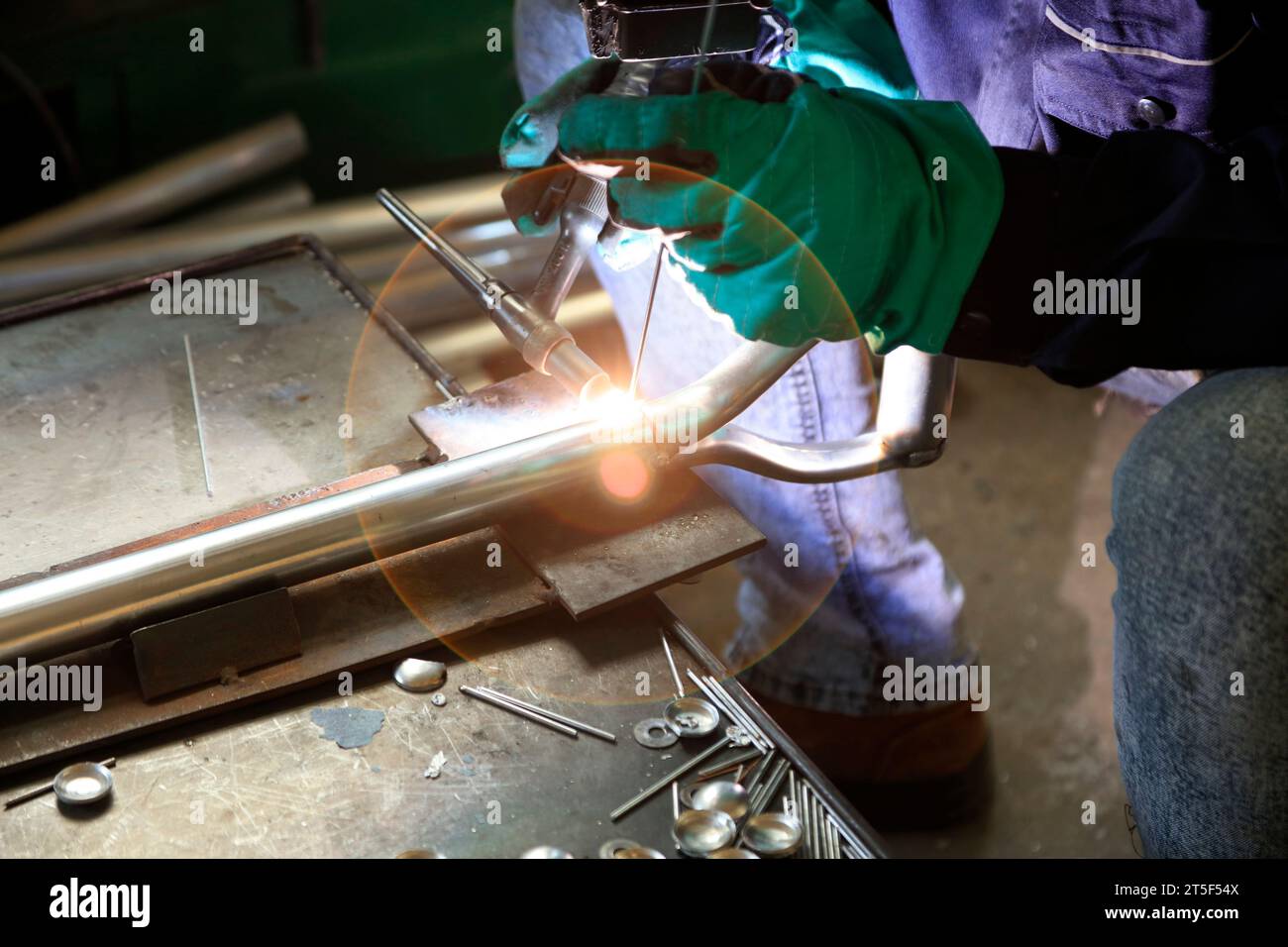 Welding of steel spade handle Stock Photo - Alamy