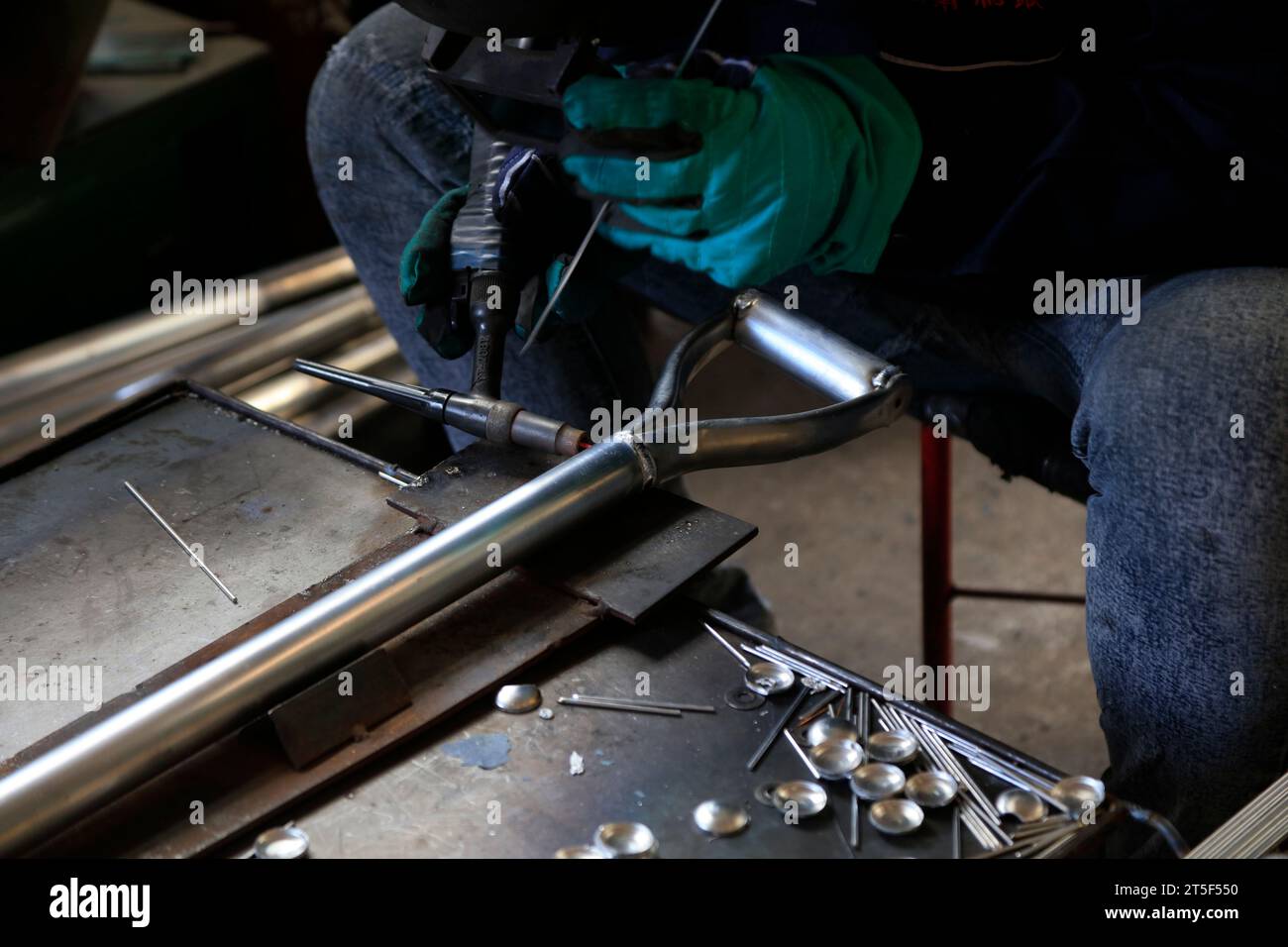 Welding of steel spade handle Stock Photo - Alamy