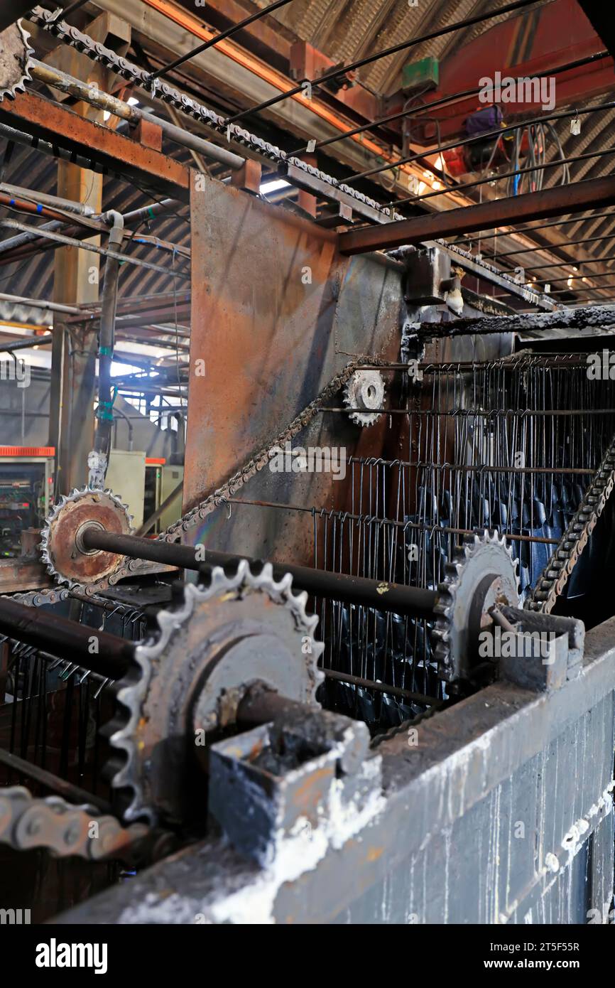 Transmission gear of steel spade production line Stock Photo - Alamy