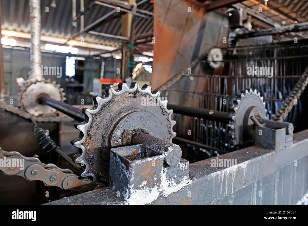 Transmission gear of steel spade production line Stock Photo - Alamy