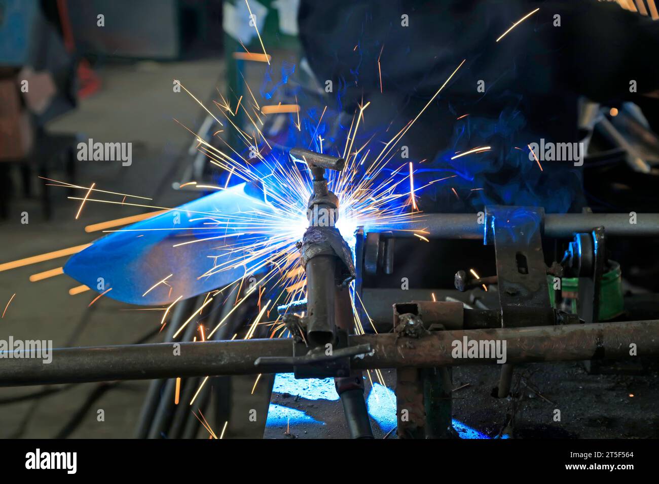 Automatic welding production line for steel spade Stock Photo - Alamy