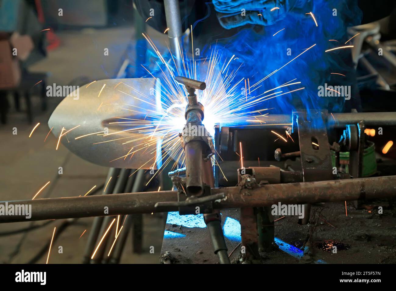 Automatic welding production line for steel spade Stock Photo - Alamy