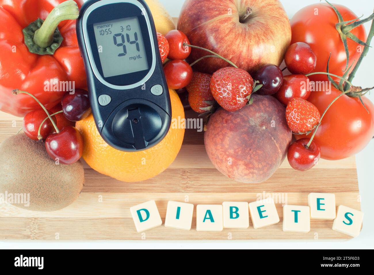 Glucometer with result of measurement sugar level and fresh ripe ...
