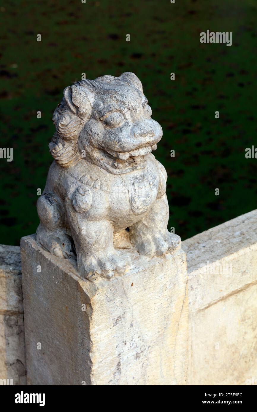 Ancient Chinese stone lion sculpture Stock Photo - Alamy
